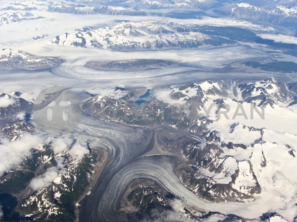 Aerial views of snow-capped mountains, ice fields, and glaciers