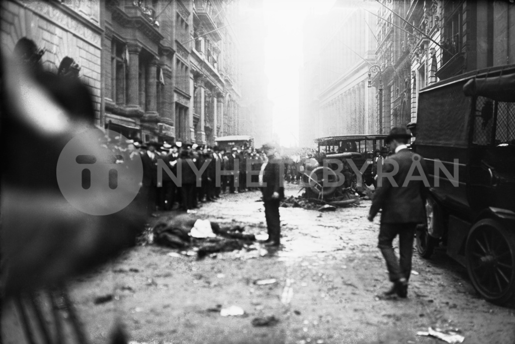 The Wall Street Bombing. A man stands over a dead horse, after the ...