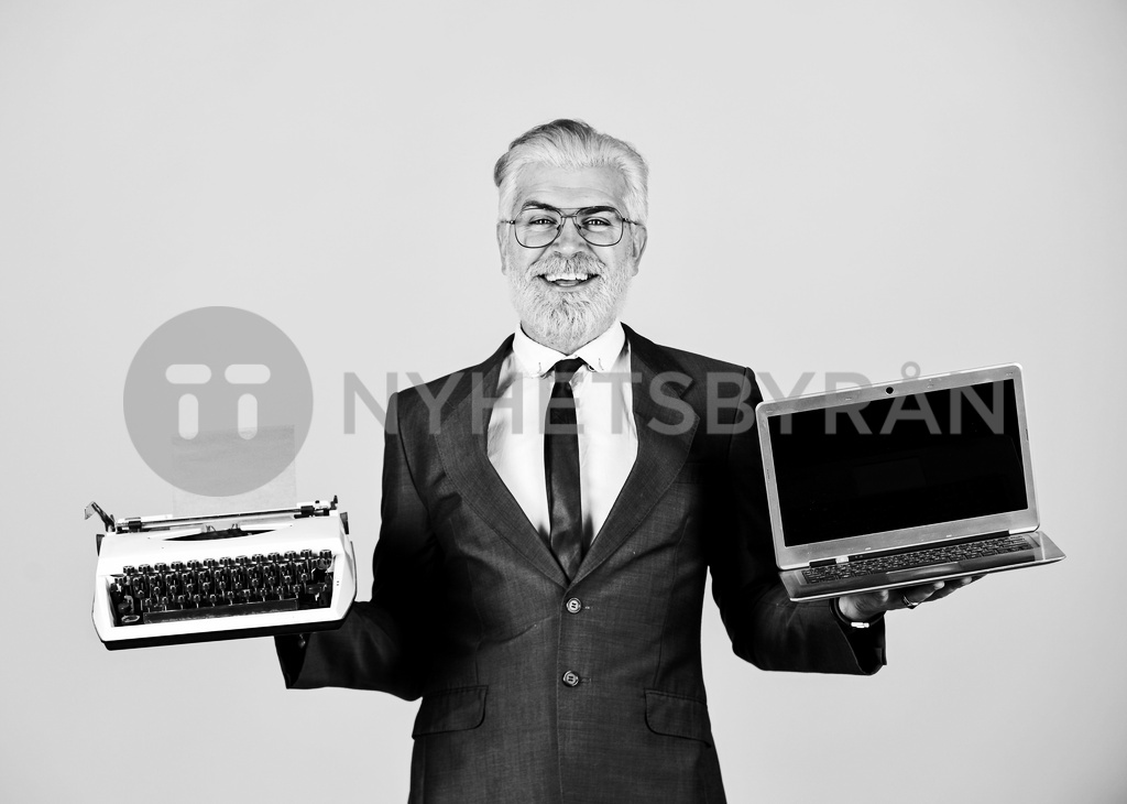 Working Online. vintage typewriter. successful businessman use retro ...