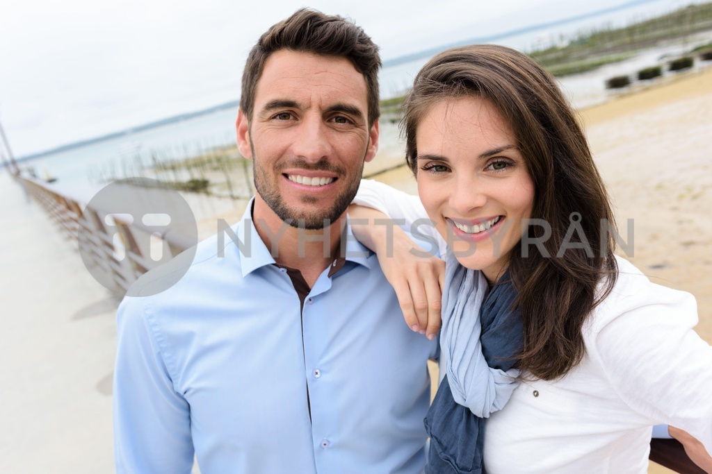 happy couple at a lake in the countryside