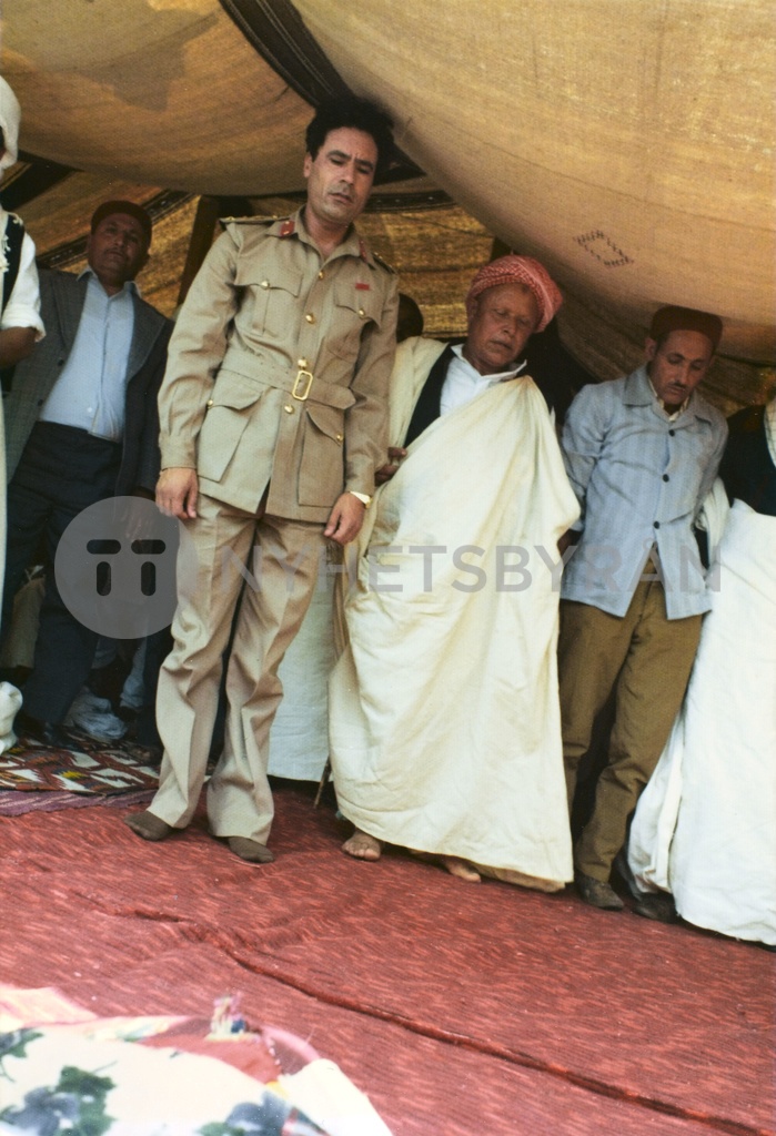 Muammar Gaddafi and Men praying - Sousa, Libya