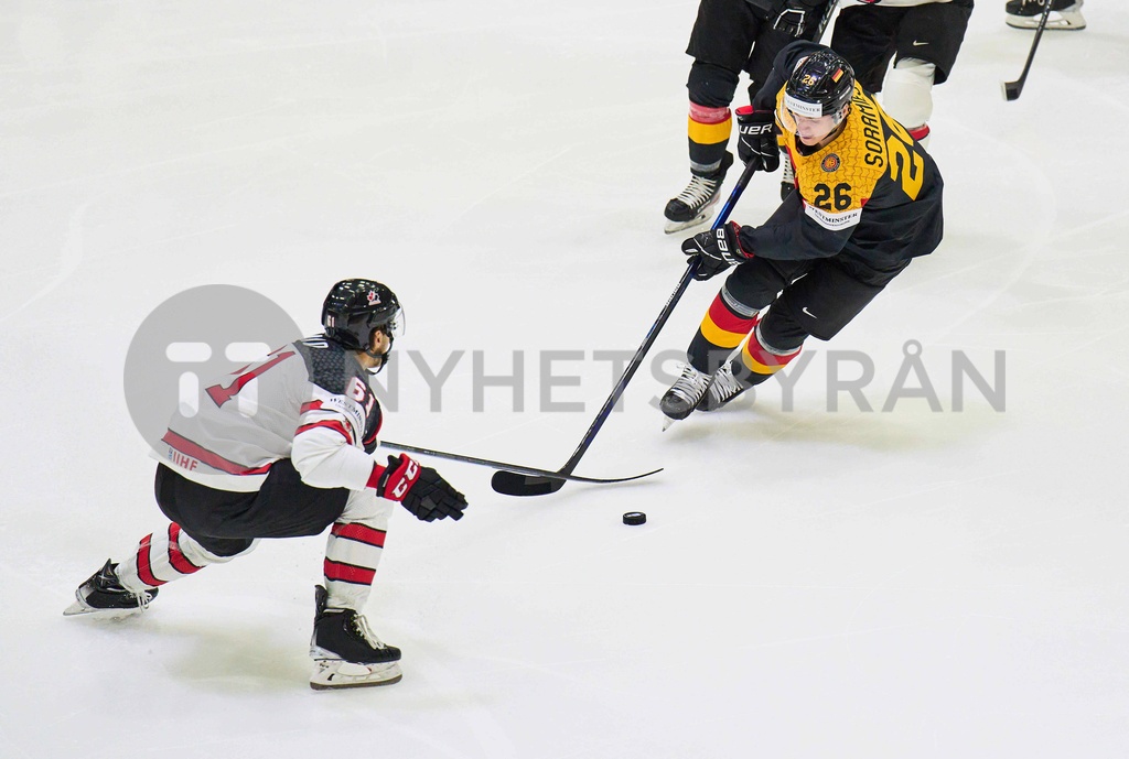 Samuel Soramies Nr.26 of Germany compete, fight for the puck against, Dysin Mayo Nr. 61 of ...