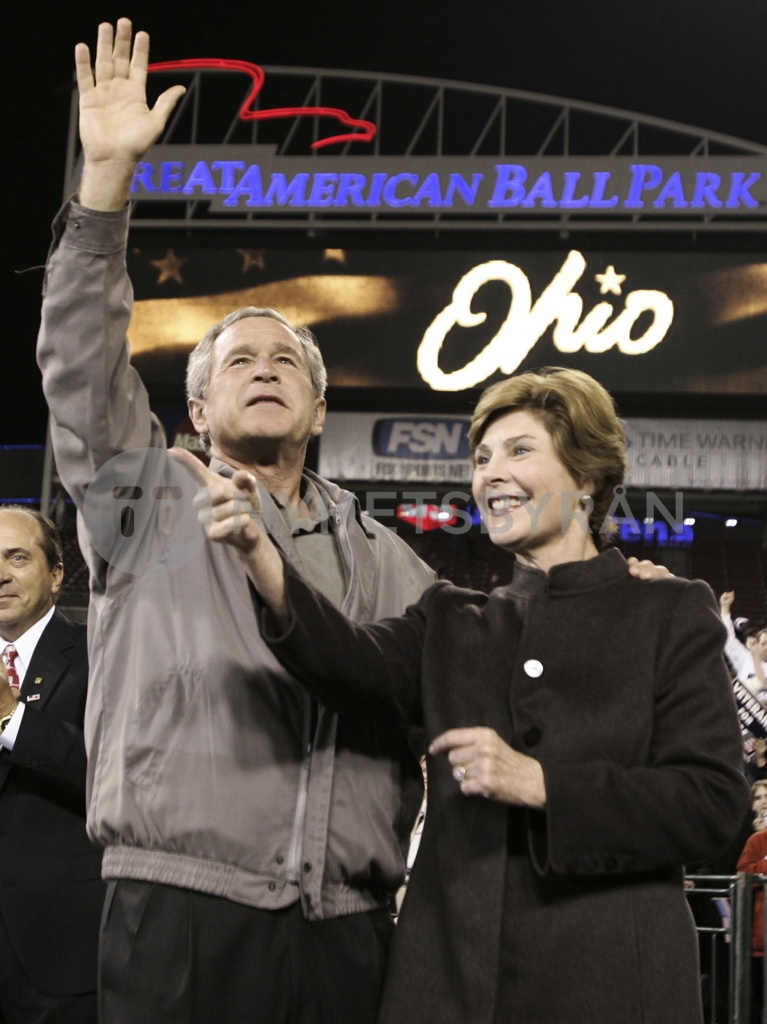 U.S. President George W. Bush and first lady Laura Bush wave to ...